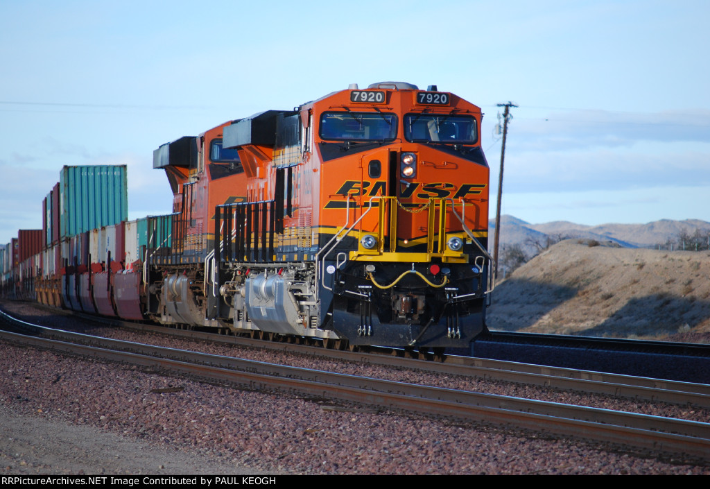 BNSF 7920 rolls west with her crew door ajar as a rear DPU unit on a westbound Z-Train.